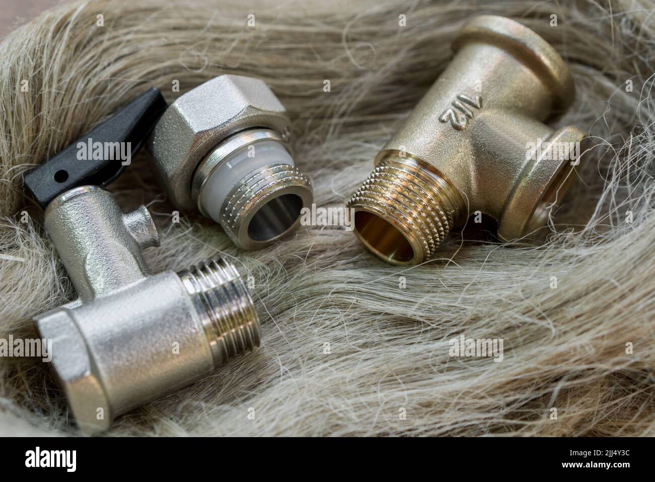 Set of plumbing equipment on a skein of tow. Plumbing industry concept ...