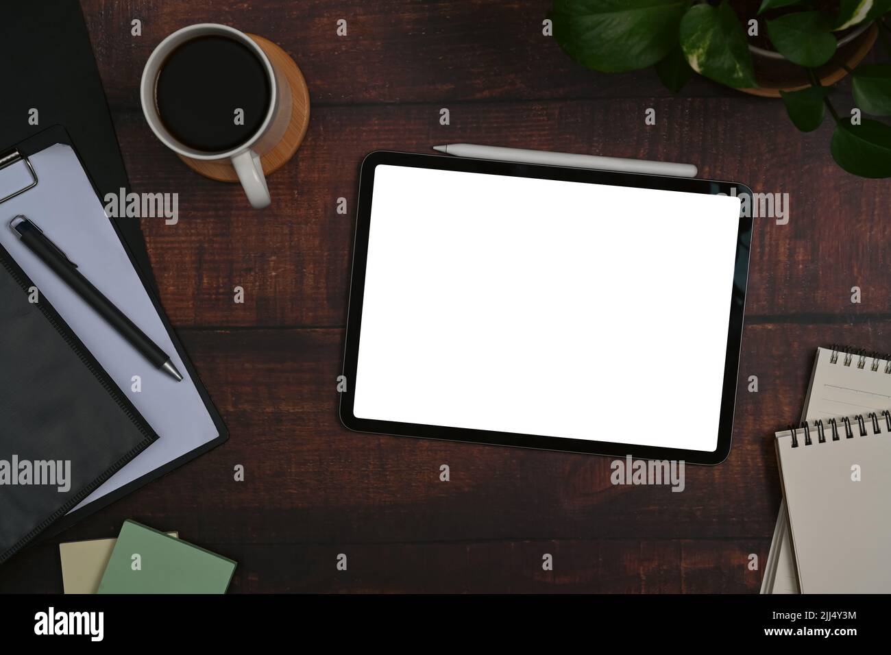 Flat lay digital tablet, notebooks, coffee cup and houseplant on wooden office desk Stock Photo ...