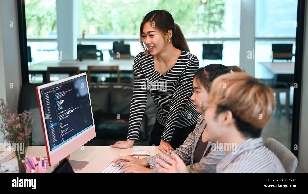 Team Of Coders Brainstorming Working Together For Developing Website Design And Coding 