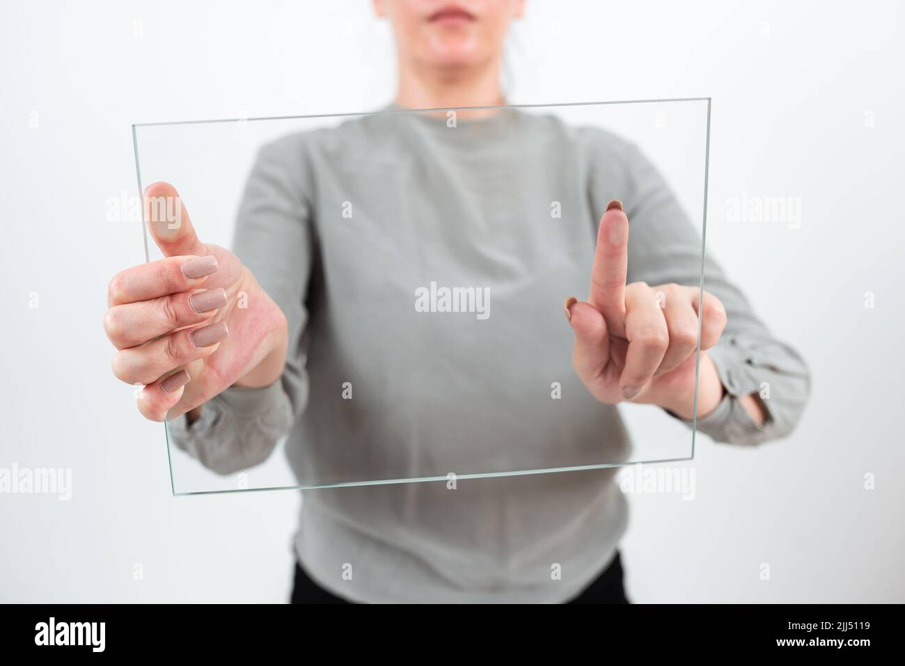 Female Professional Holding And Pointing On Transparent Glass While ...