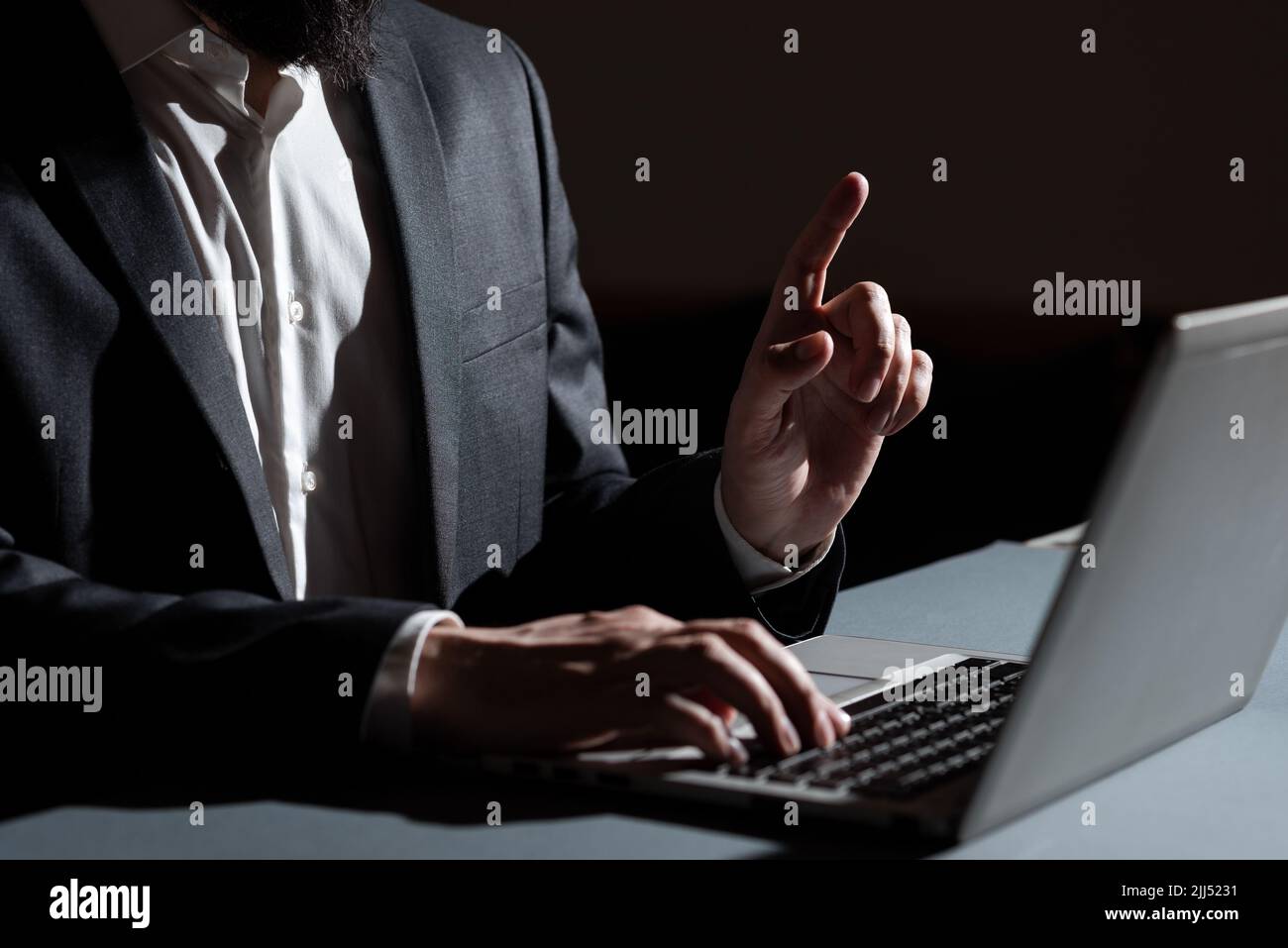 Businessman Typing Important Informations Into Lap Top And Pointing New ...