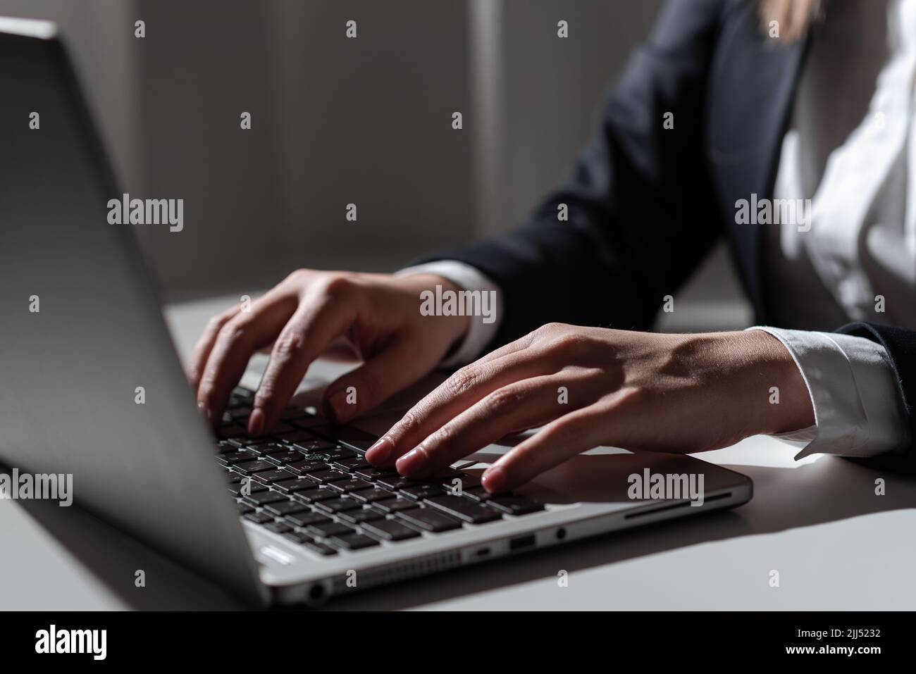 Businesswoman Typing Recent Updates On Lap Top Keyboard On Desk. Woman ...