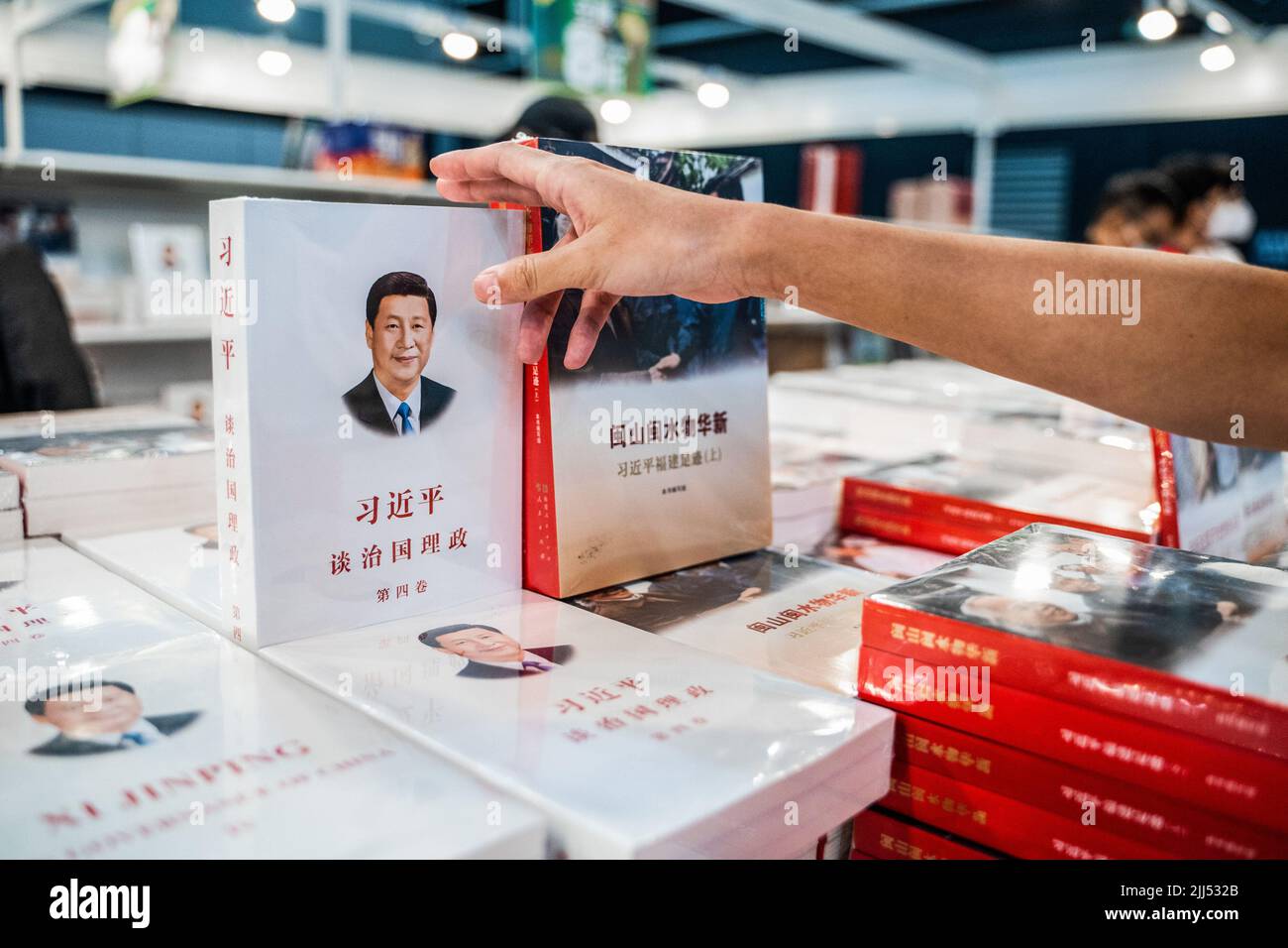 Hong Kong, China. 22nd July, 2022. A person picks a book of Chinese ...