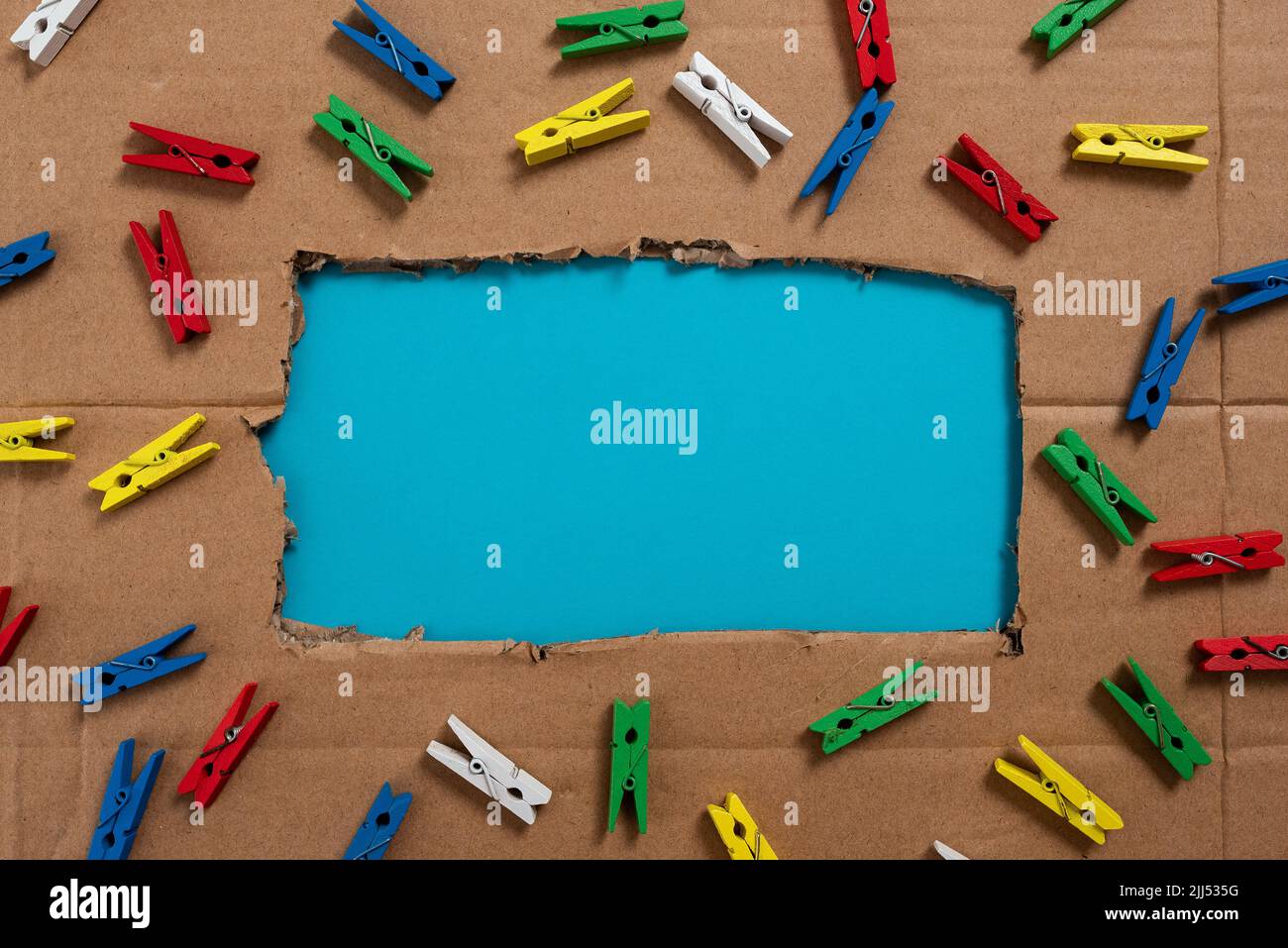 Important Informations Written Under Ripped Cardboard With Colored Pegs ...