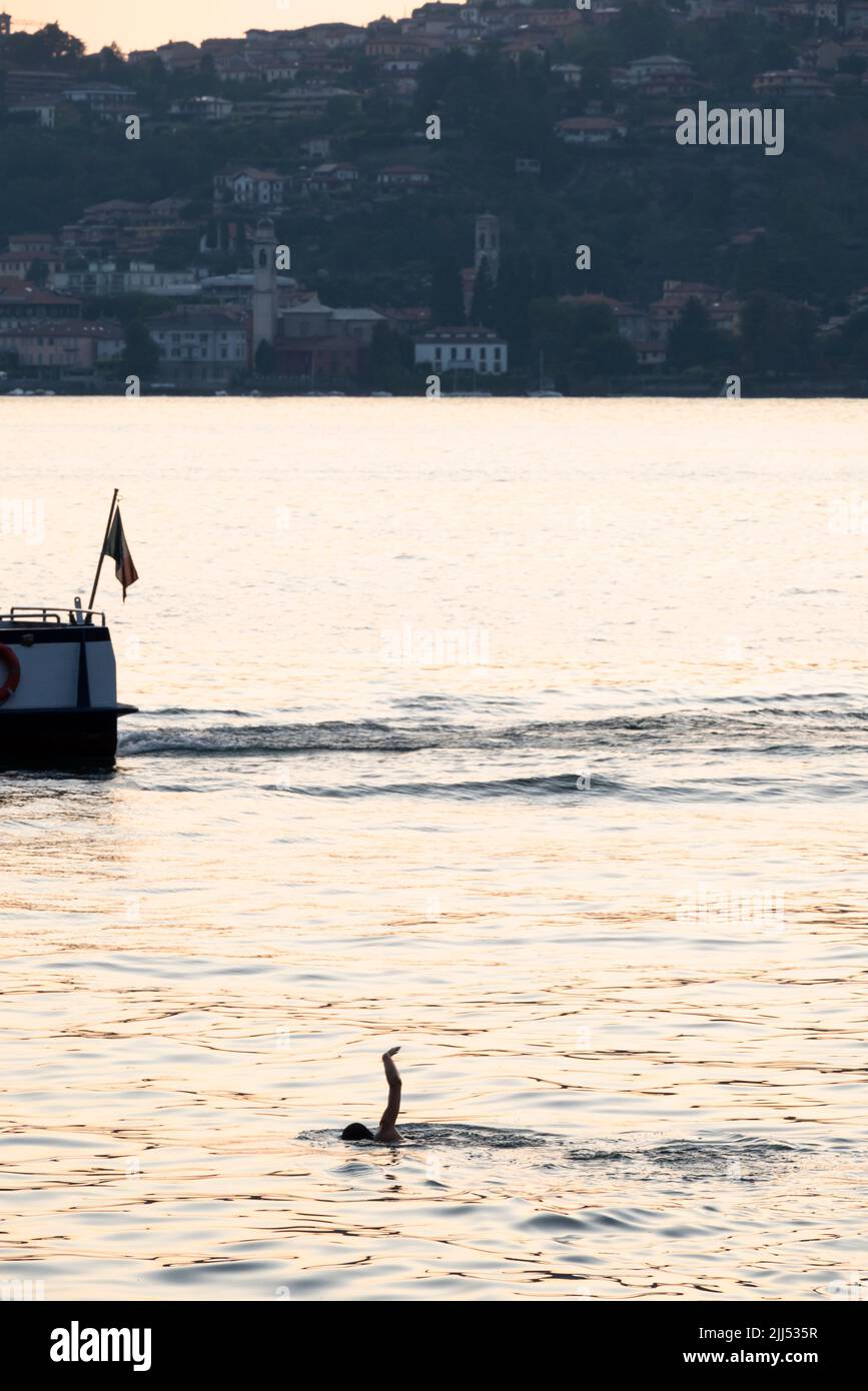 Man chasing a boat and asking for help Stock Photo - Alamy