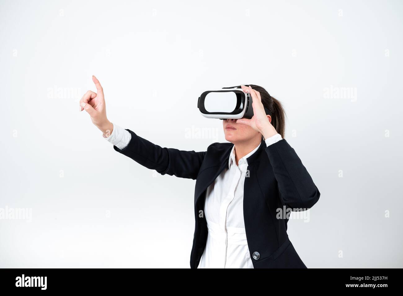 Woman Wearing Vr Glasses And Pointing On Important Messages With One Finger. Businesswoman ...