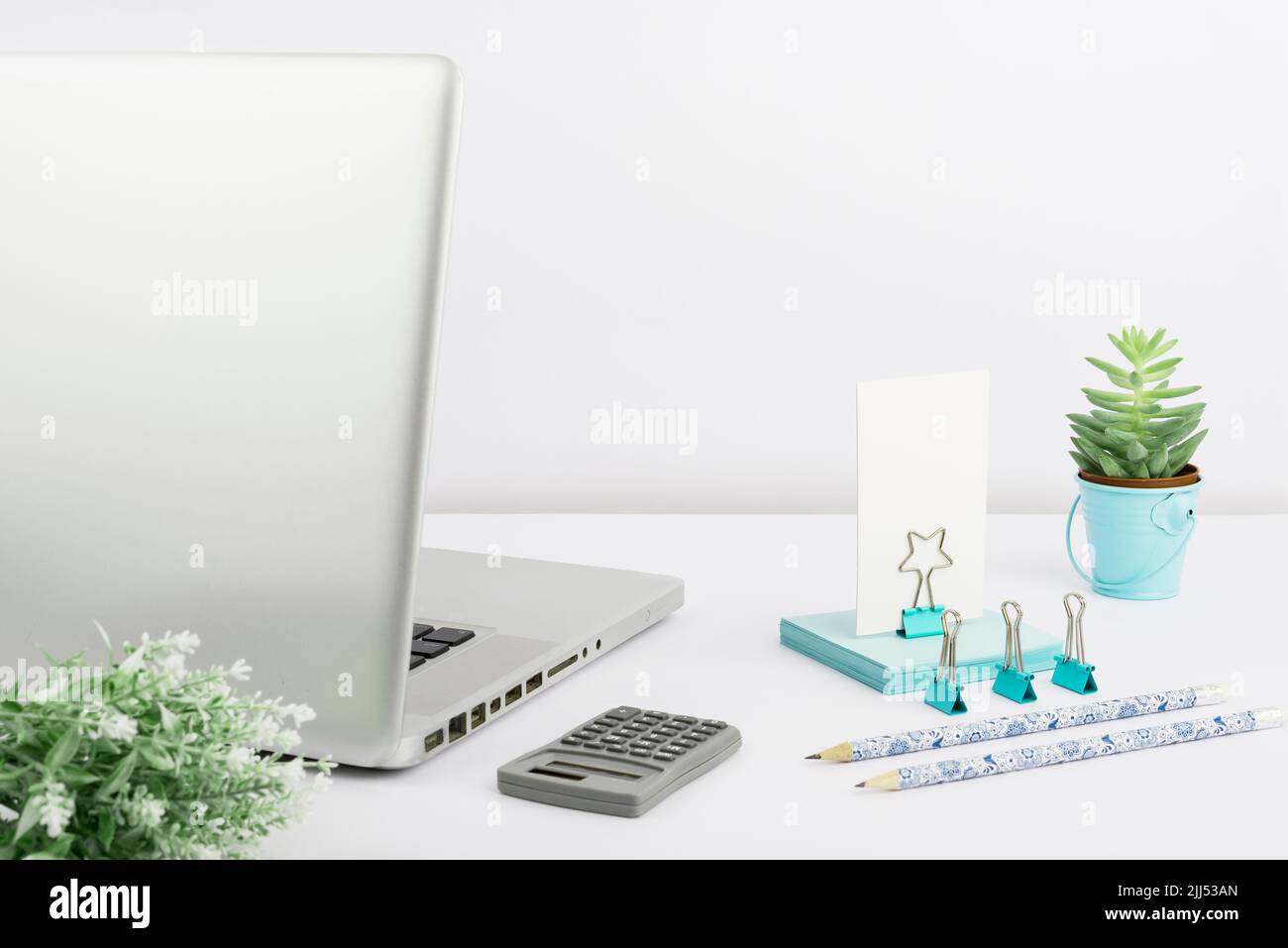 Lap Top, Pencils, Calculator, Paperclips, Flowers And Sticky Notes ...