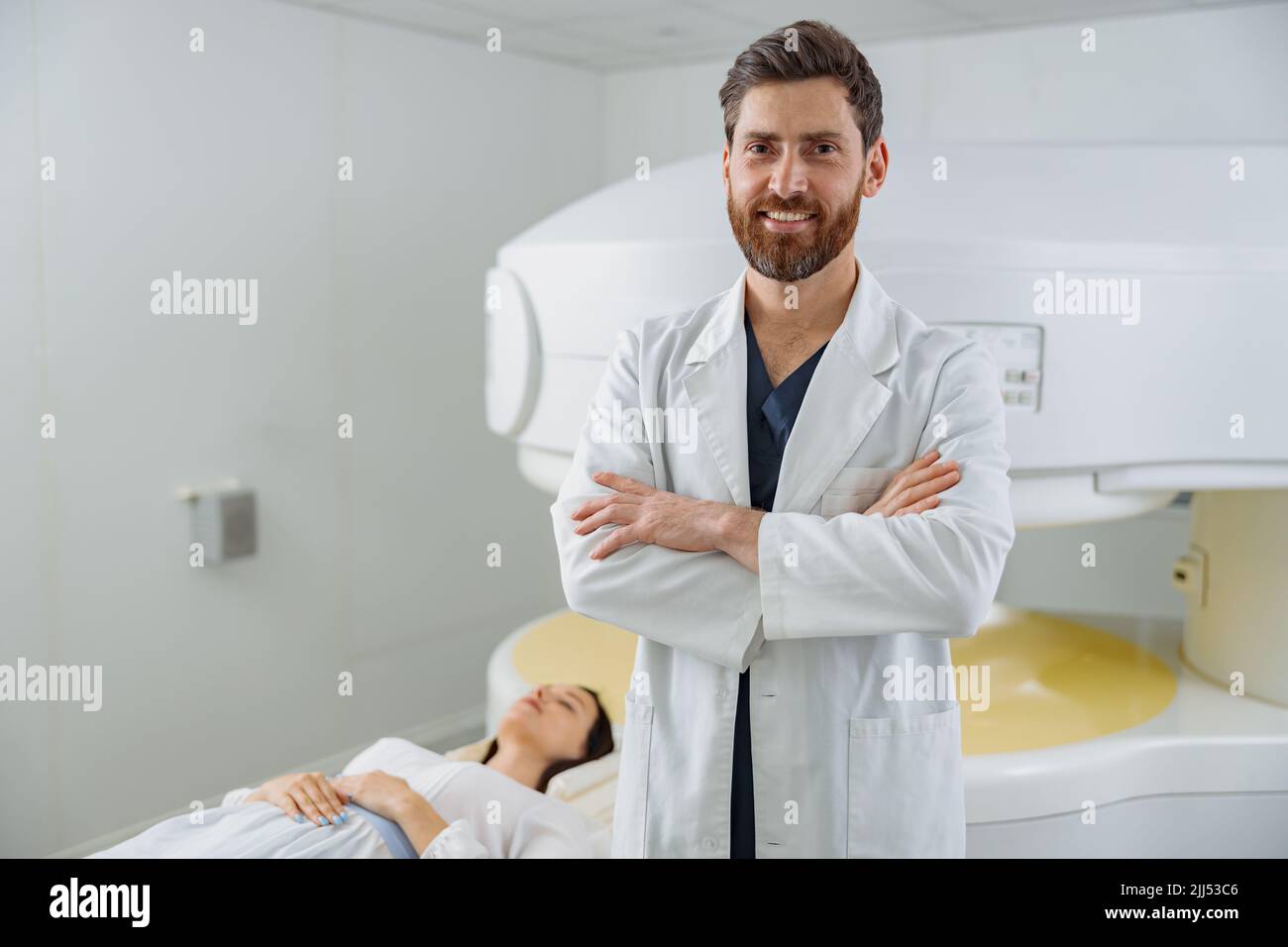 Radiologist on background of MRI or CT or PET Scan with female patient ...