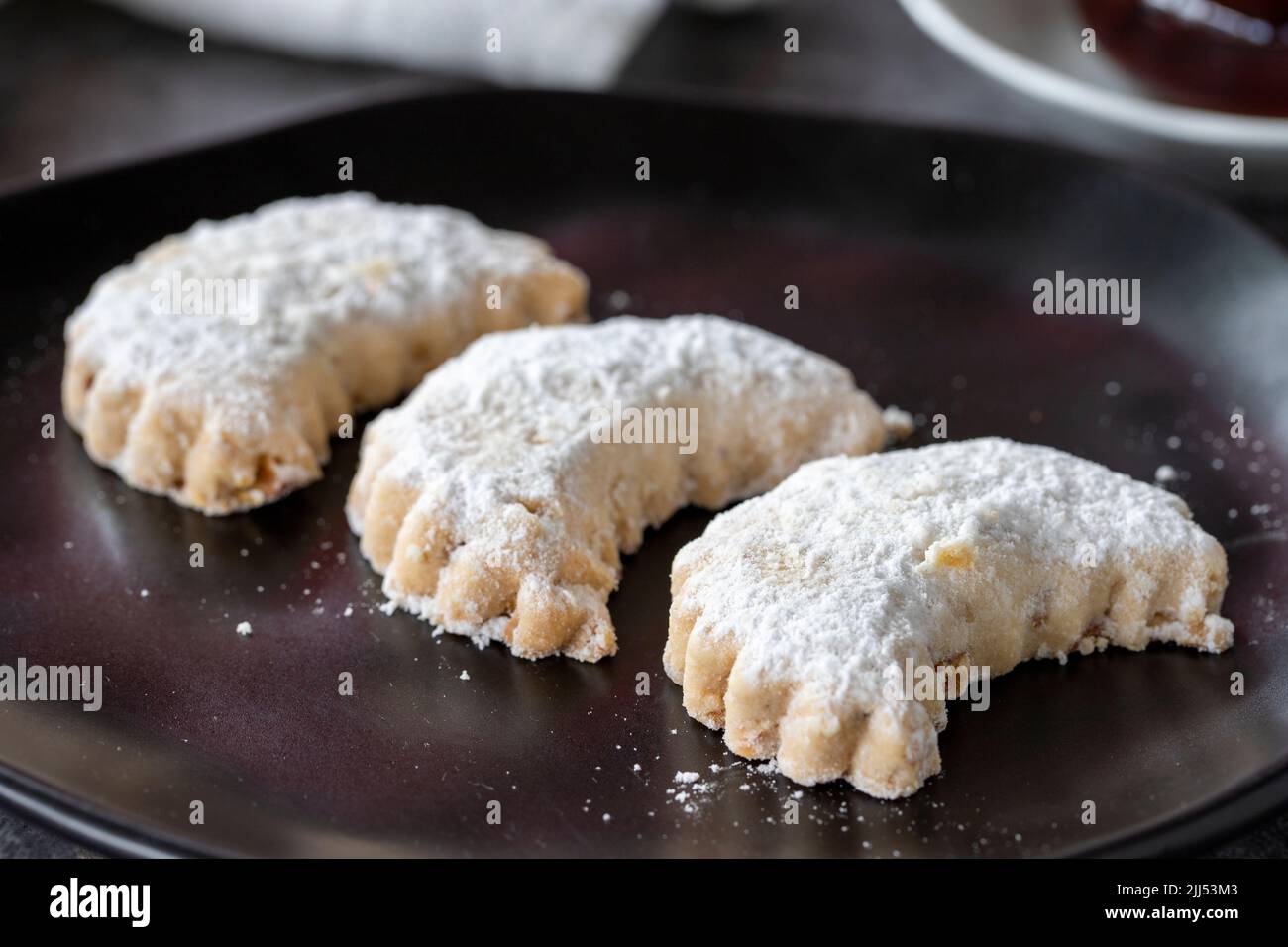 Sweet almond cookies. Delicious snack cookies on dark background ...