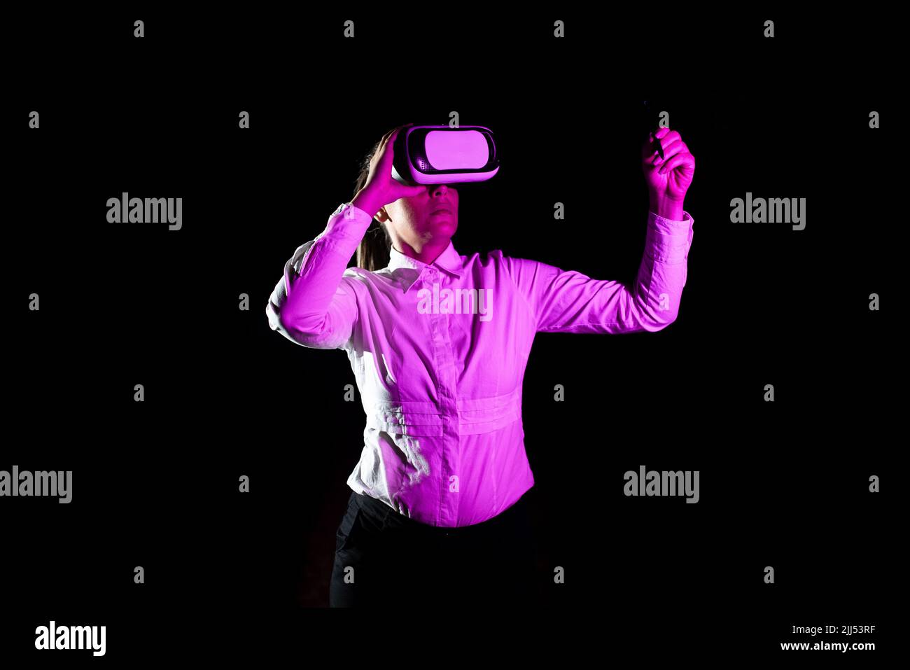 Female Manager Wearing Virtual Reality Headset Holding Pet While Taking ...