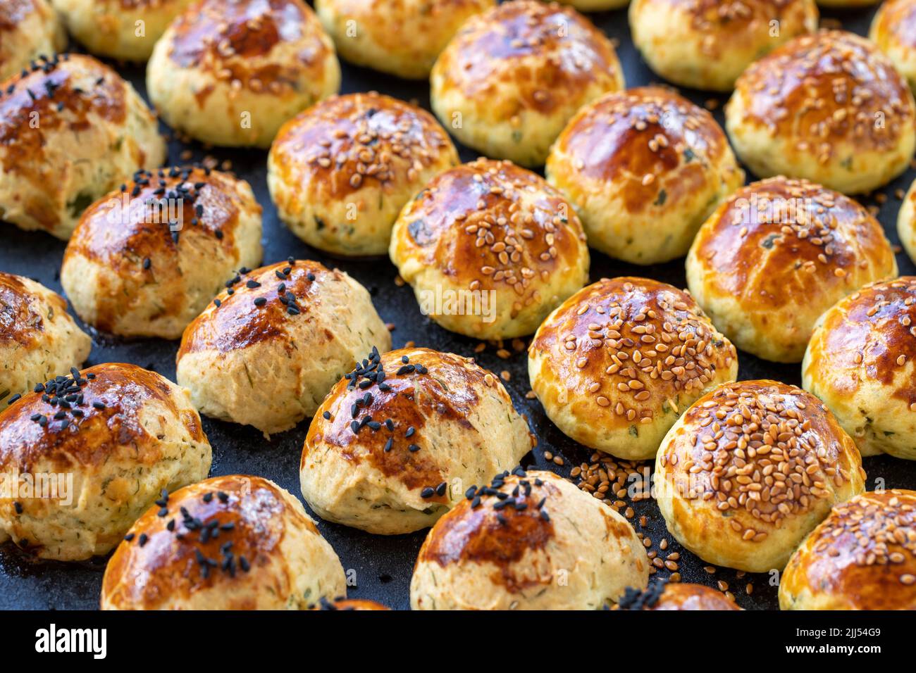 Sesame cookies. Fresh salt cookies on dark background. Bakery products ... Sesame cookies. Fresh salt cookies on dark background. Bakery products ...