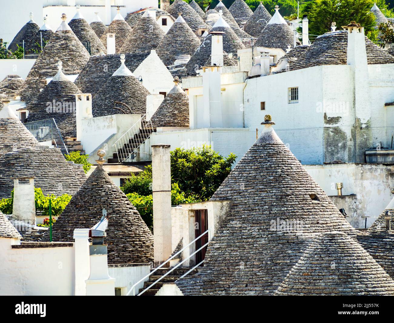 Alberobello, stunning view of trulli houses with typical conical roofs ...