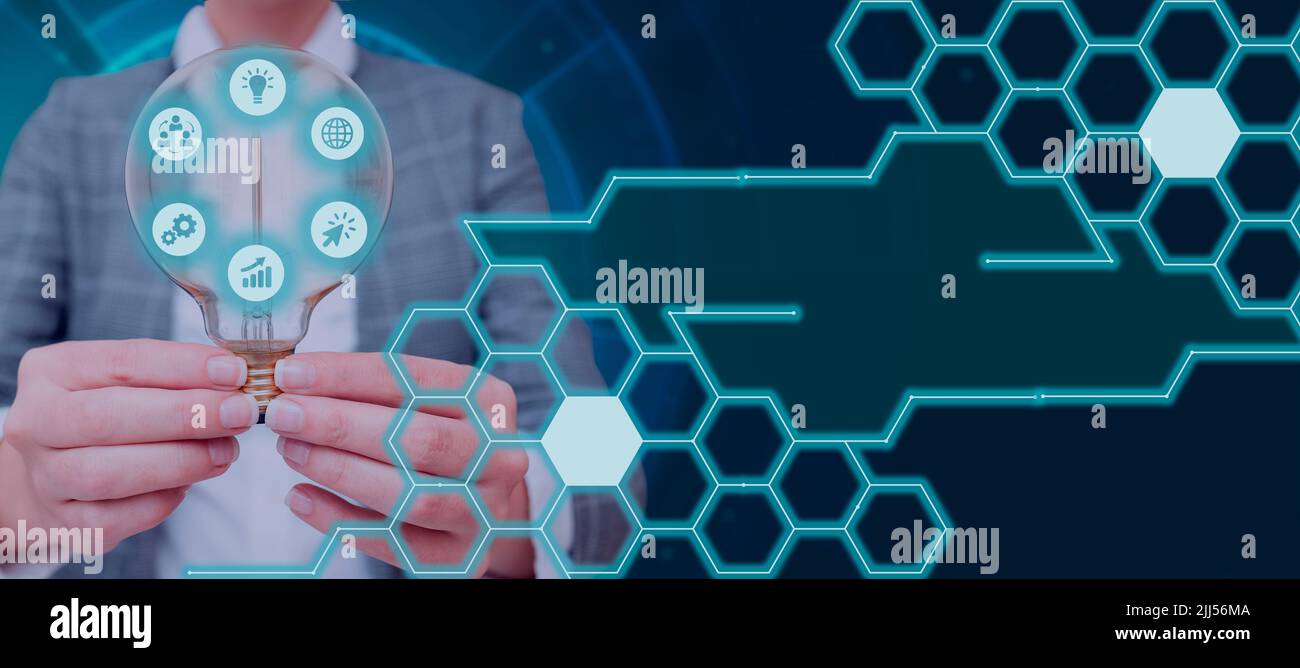 Businesswoman Holding With Two Hands A Light Bulb Image With Digital S Inside In A Hexagon ...