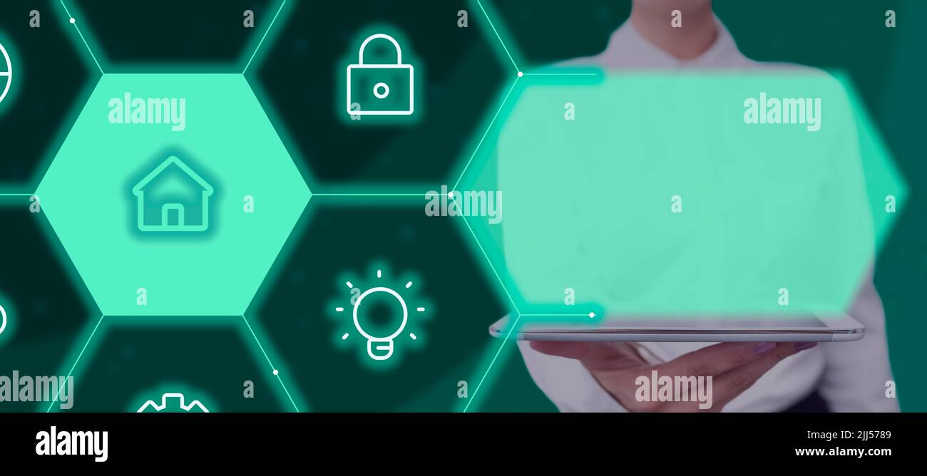 Businesswoman Holding A Tablet With Digital Symbols And Laptop In A ...