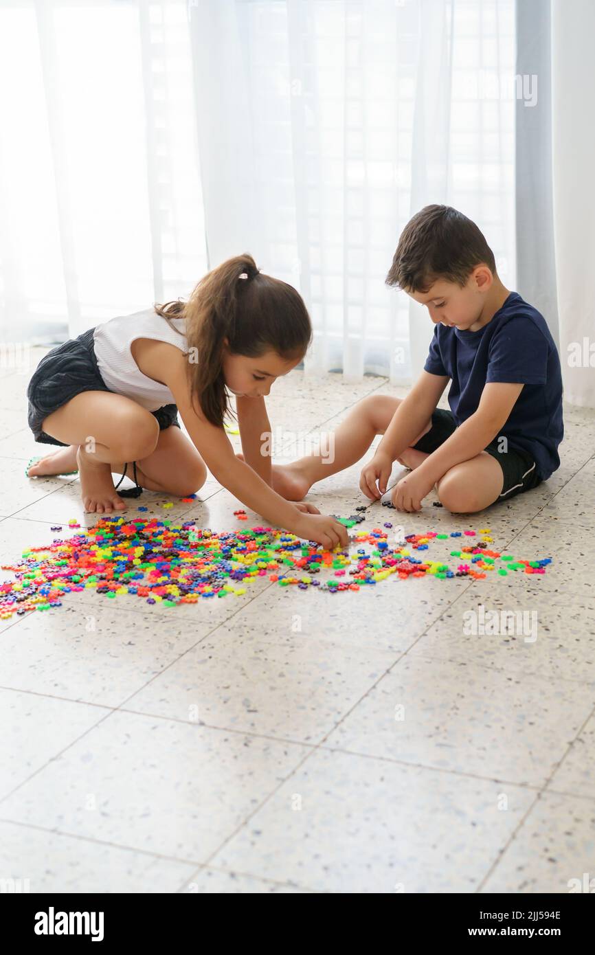 Children having fun and building out of constructor bricks. Early ...