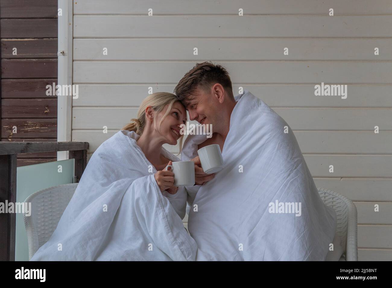 Happy blanket drink couple guy girl cute married embracing enjoy ...