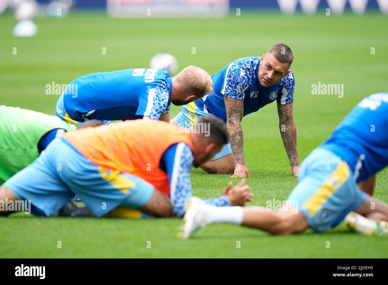 Jack Hunt #32 of Sheffield Wednesday talks with Barry Bannan #10 during ...