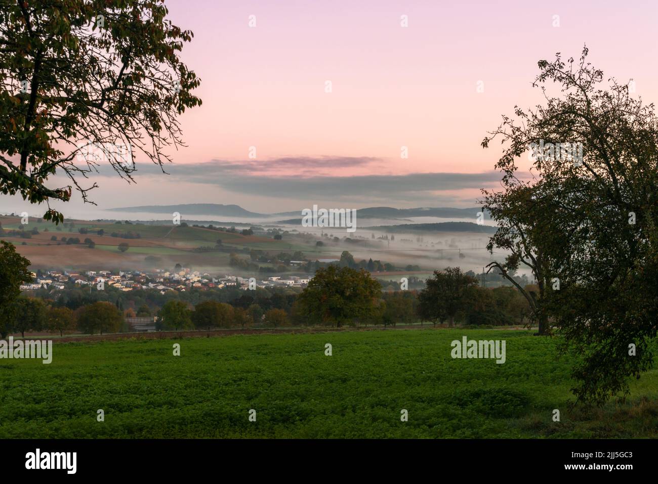Sunrise over rolling hills and pastures in Southern Germany Stock Photo ...
