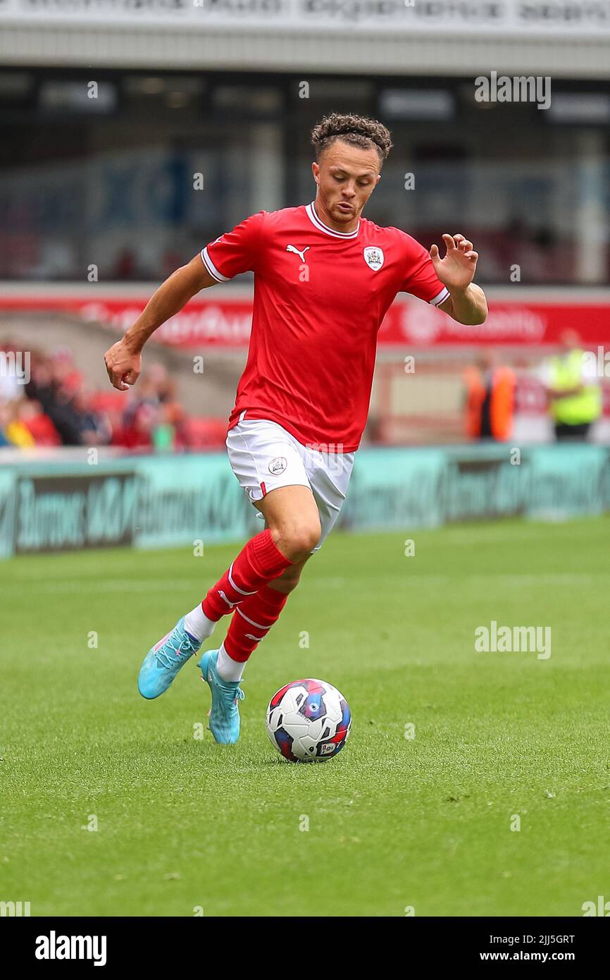 Jordan Williams #2 of Barnsley runs forward with the ball Stock Photo ...