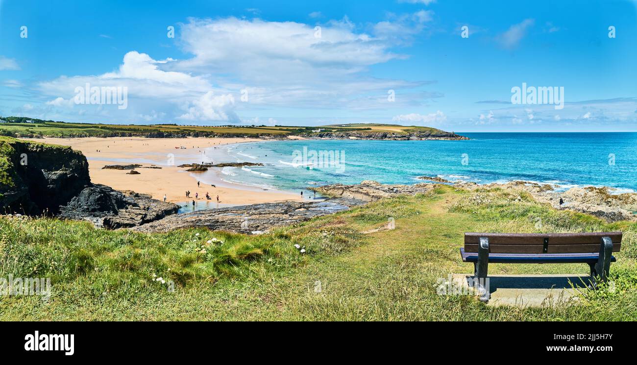 Bench on a cliff top overlooking the sandy beach at Harlyn Bay ...