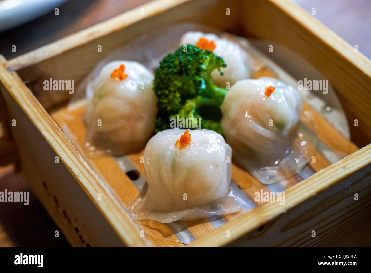A delicious Cantonese morning tea dim sum, steamed shrimp dumplings ...
