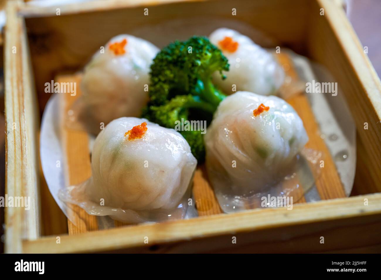 A delicious Cantonese morning tea dim sum, steamed shrimp dumplings ...