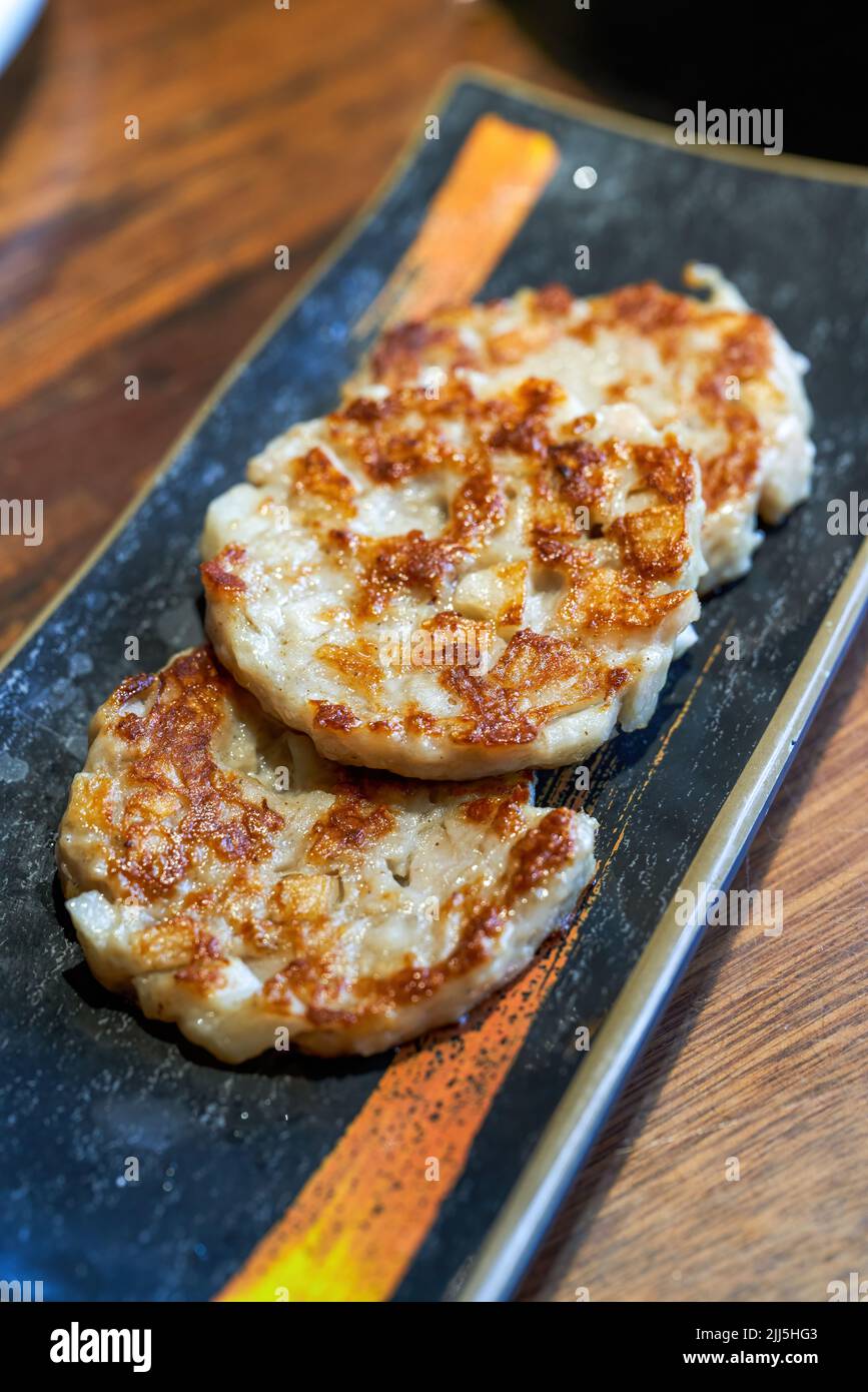 A delicious pan-fried lotus root cake Stock Photo - Alamy