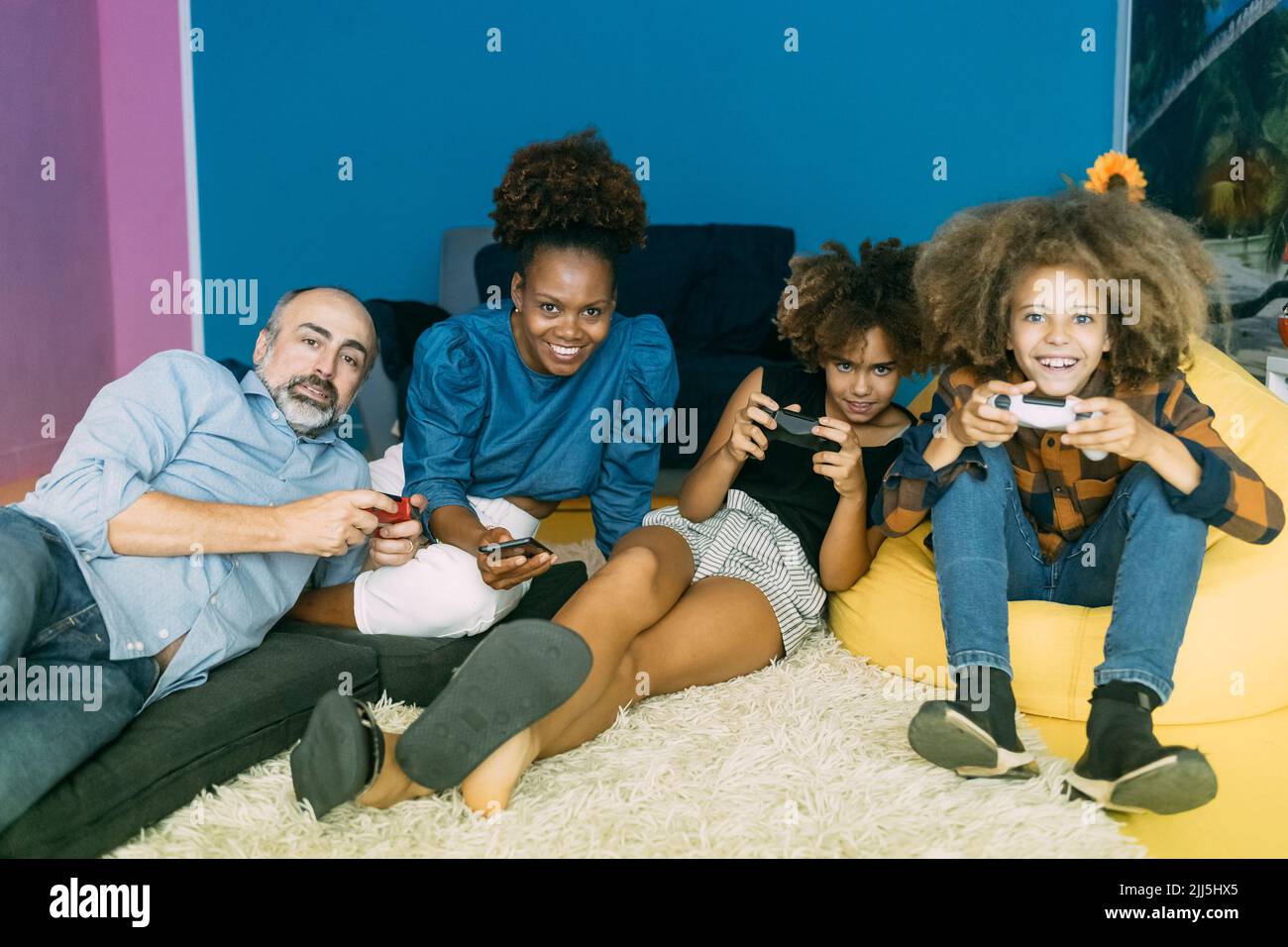 Children playing video games diverse hi-res stock photography and ...