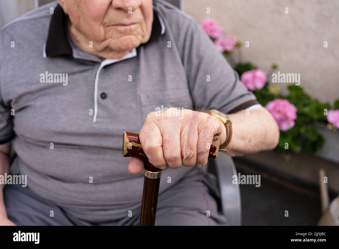 Hand of senior man holding cane Stock Photo - Alamy