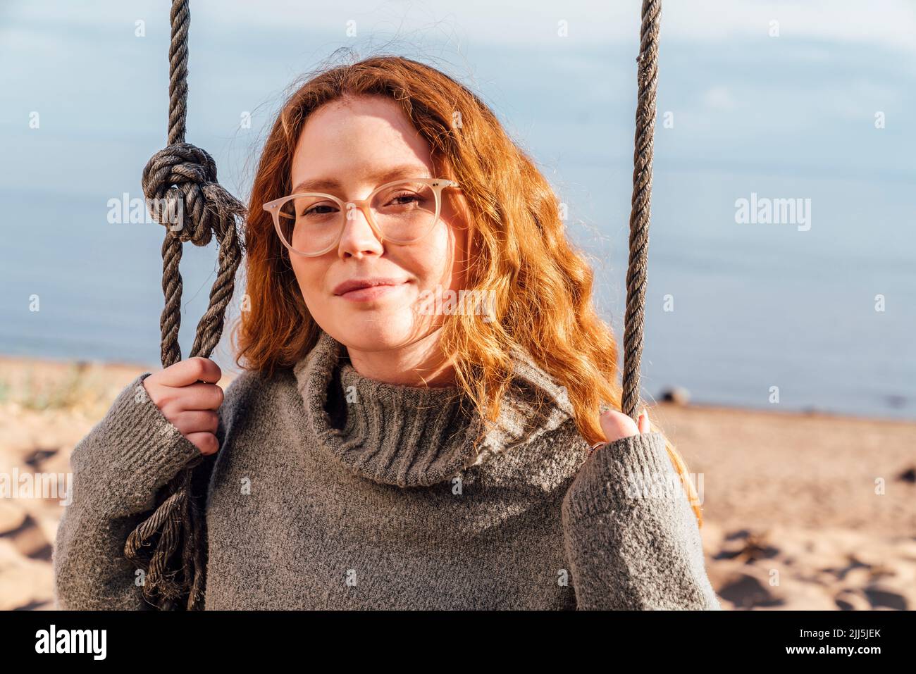Woman swings on swing in hi-res stock photography and images - Alamy