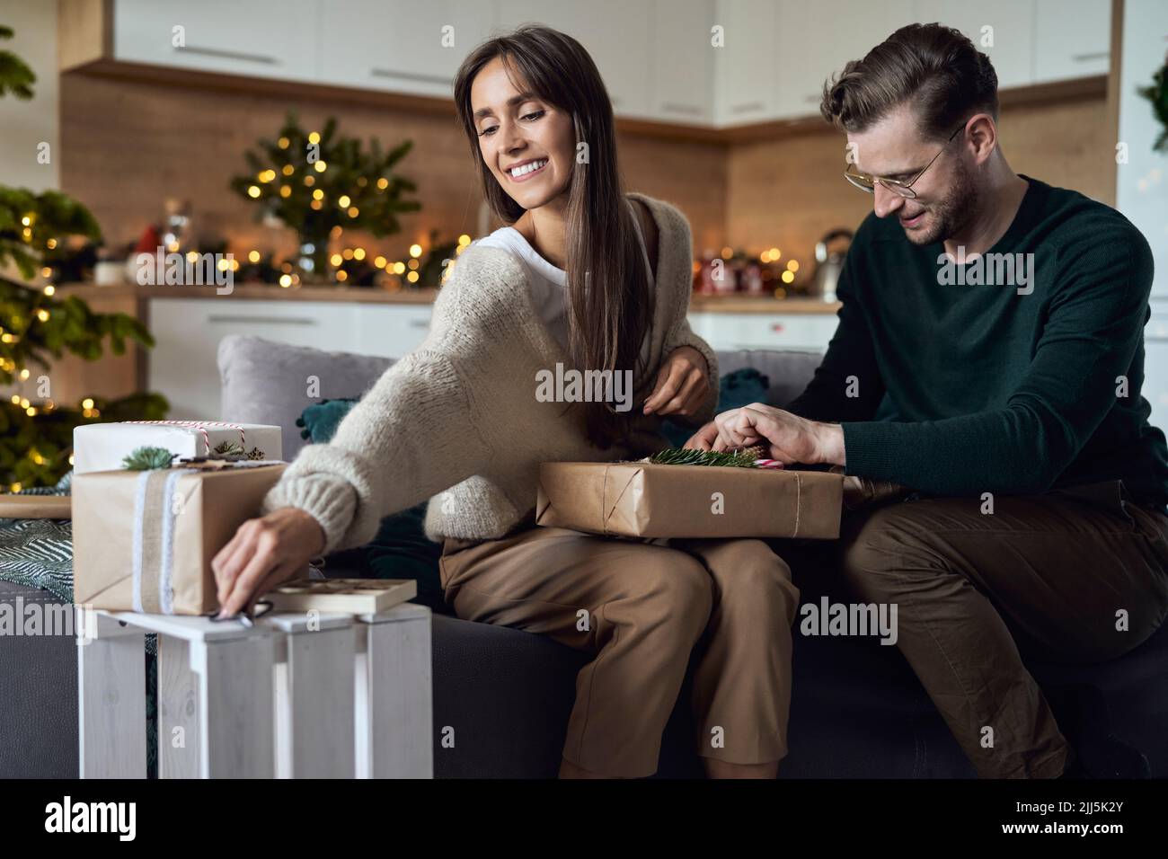 Caucasian family three packing presents hi-res stock photography and ...