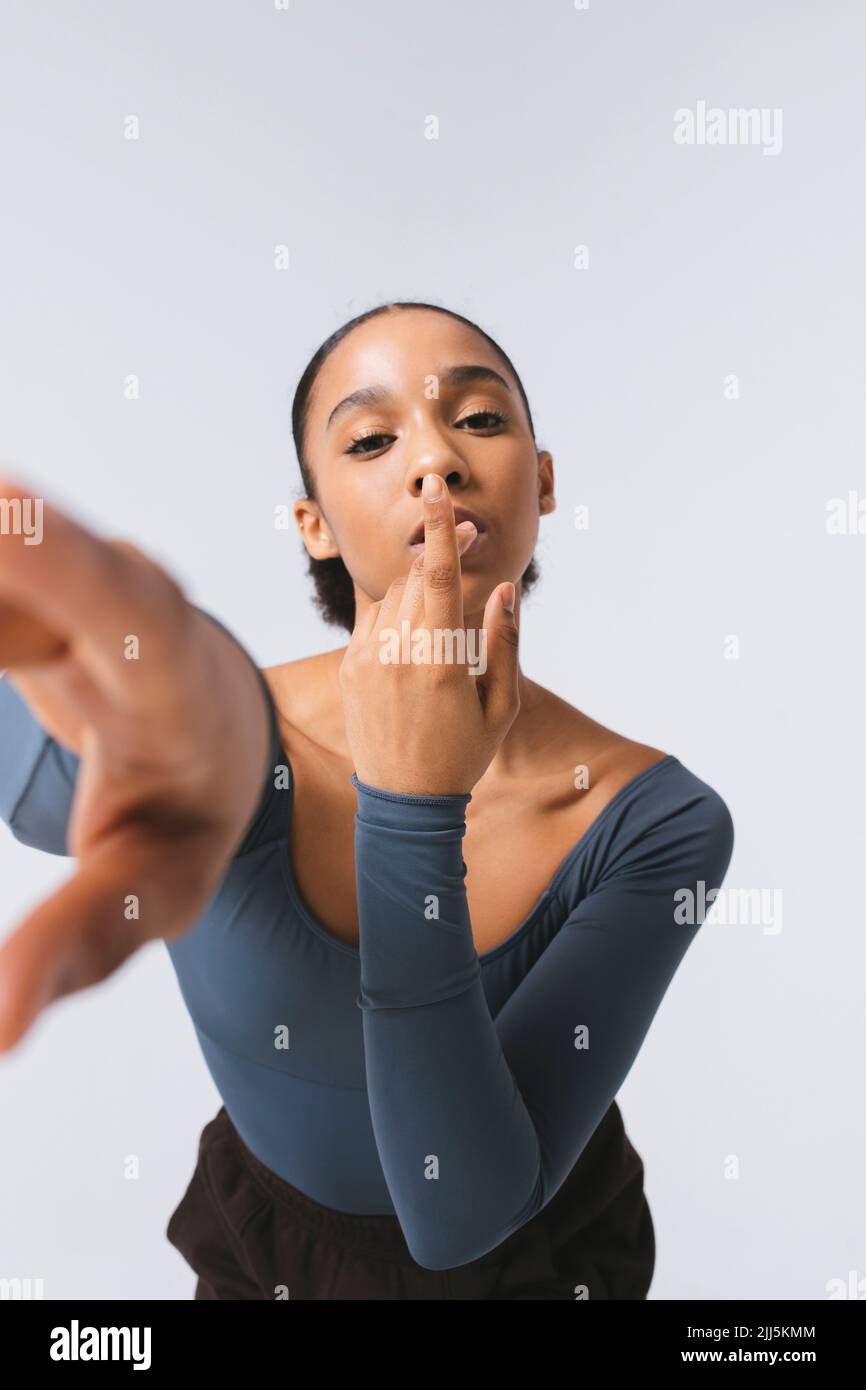 Young ballet dancer practicing against white background Stock Photo - Alamy
