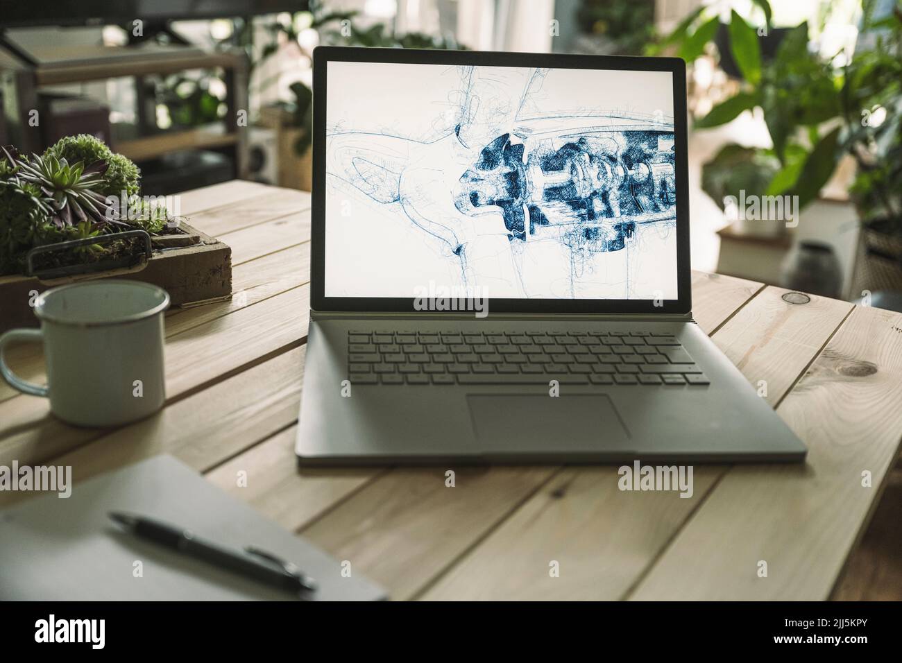 Sketch of wind turbine on laptop screen at home office Stock Photo - Alamy