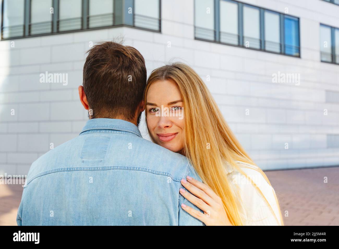 Woman hugging girl from hi-res stock photography and images - Alamy
