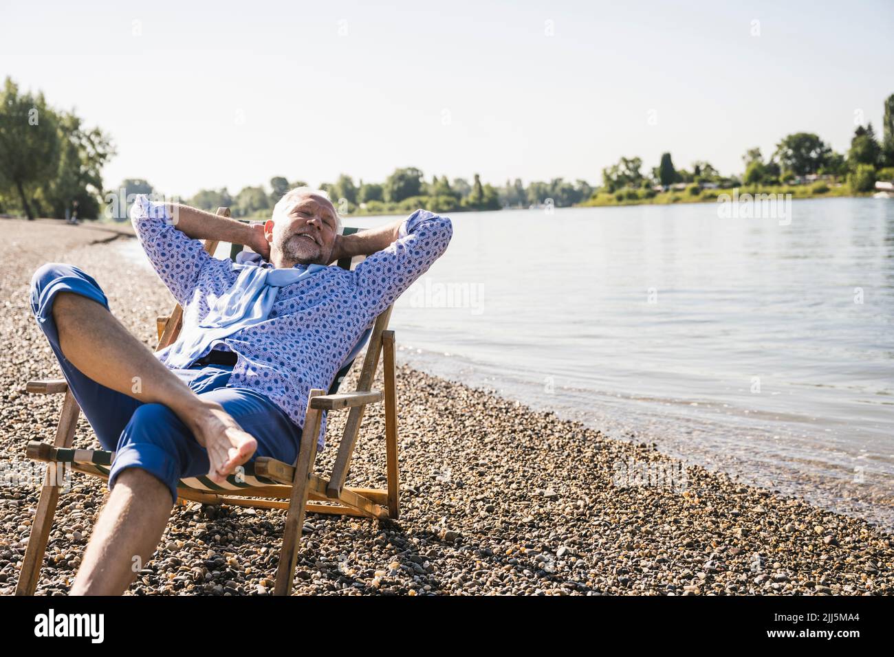Seated resting relaxing by riverbank hi-res stock photography and ...