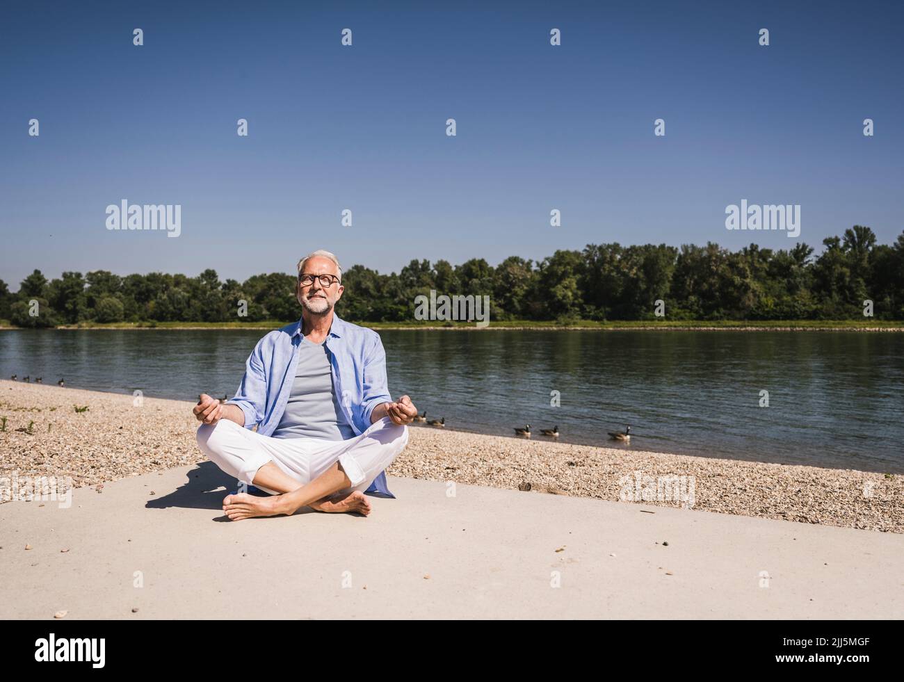 Man eyes closed breathing seated hi-res stock photography and images ...