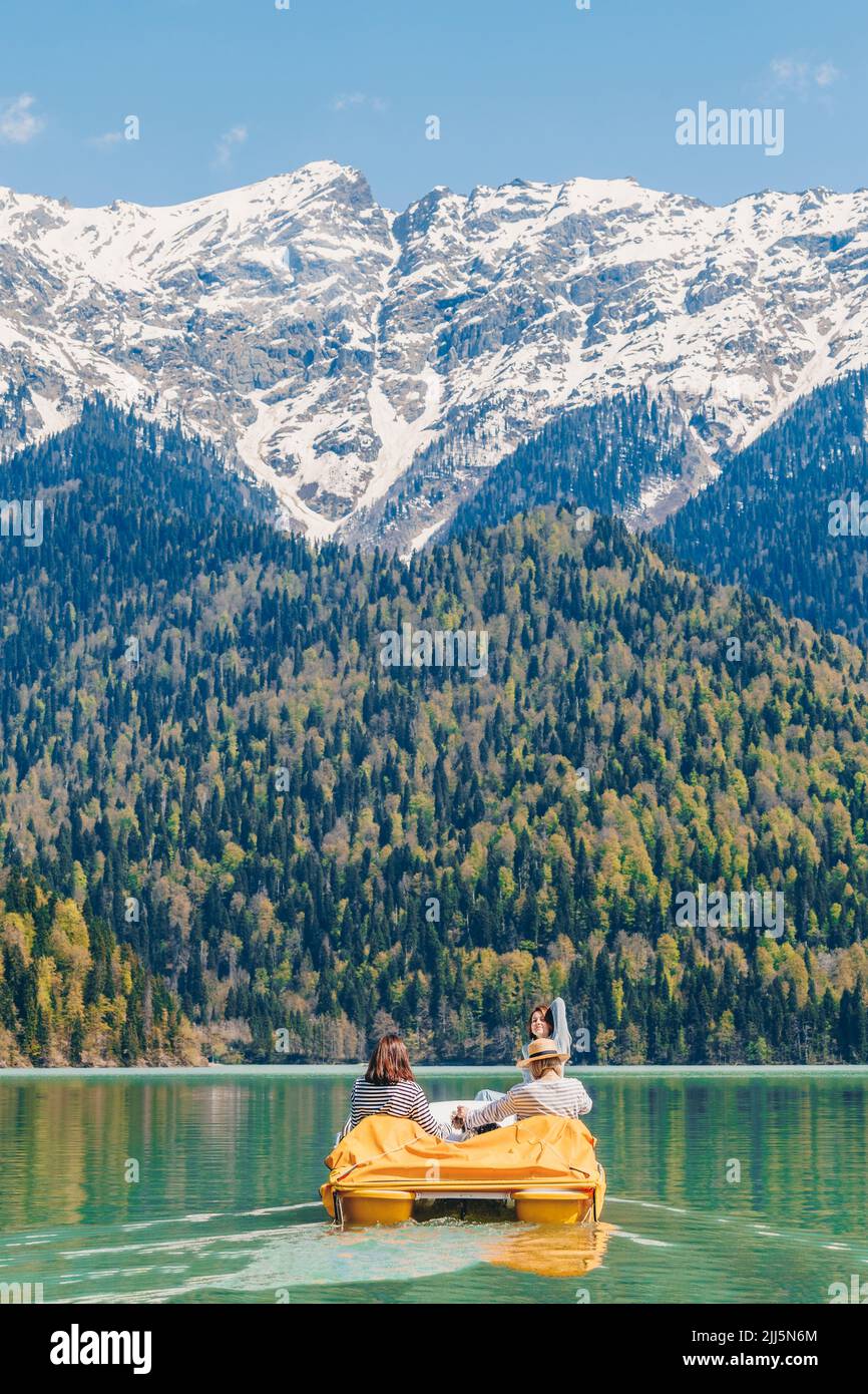 Friends enjoying pedal boat ride on Lake Ritsa Stock Photo - Alamy