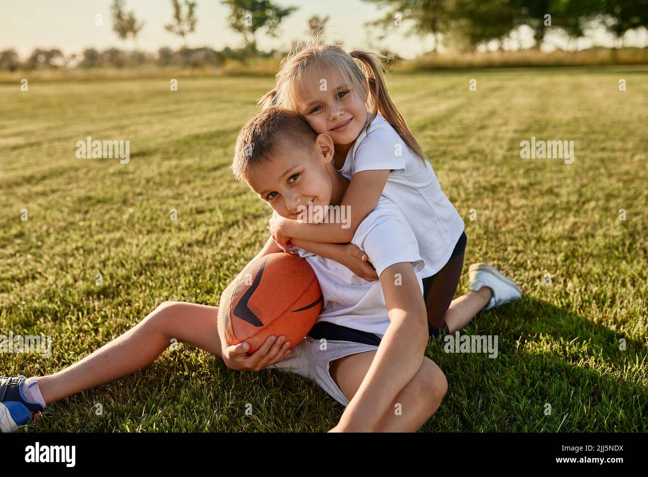 Child hugging infant siblings hi-res stock photography and images - Alamy