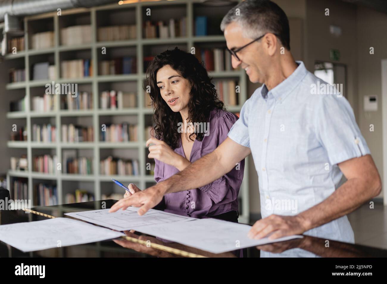 Reviewing plan hi-res stock photography and images - Alamy