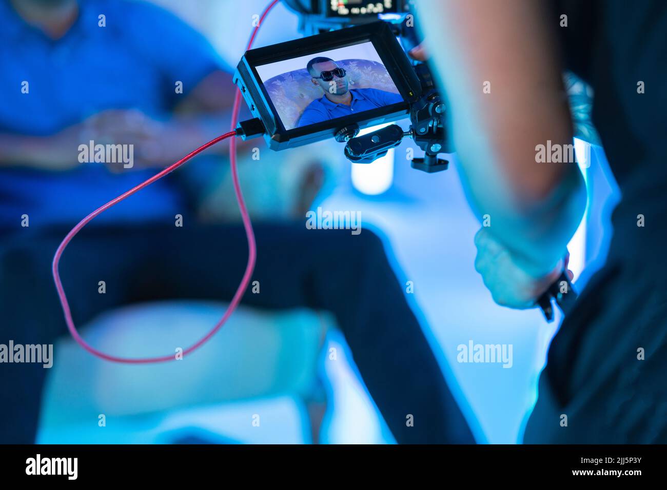 Cameraman filming music video at studio Stock Photo - Alamy