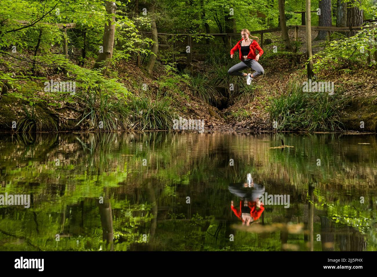 Woman jumps lake hi-res stock photography and images - Alamy