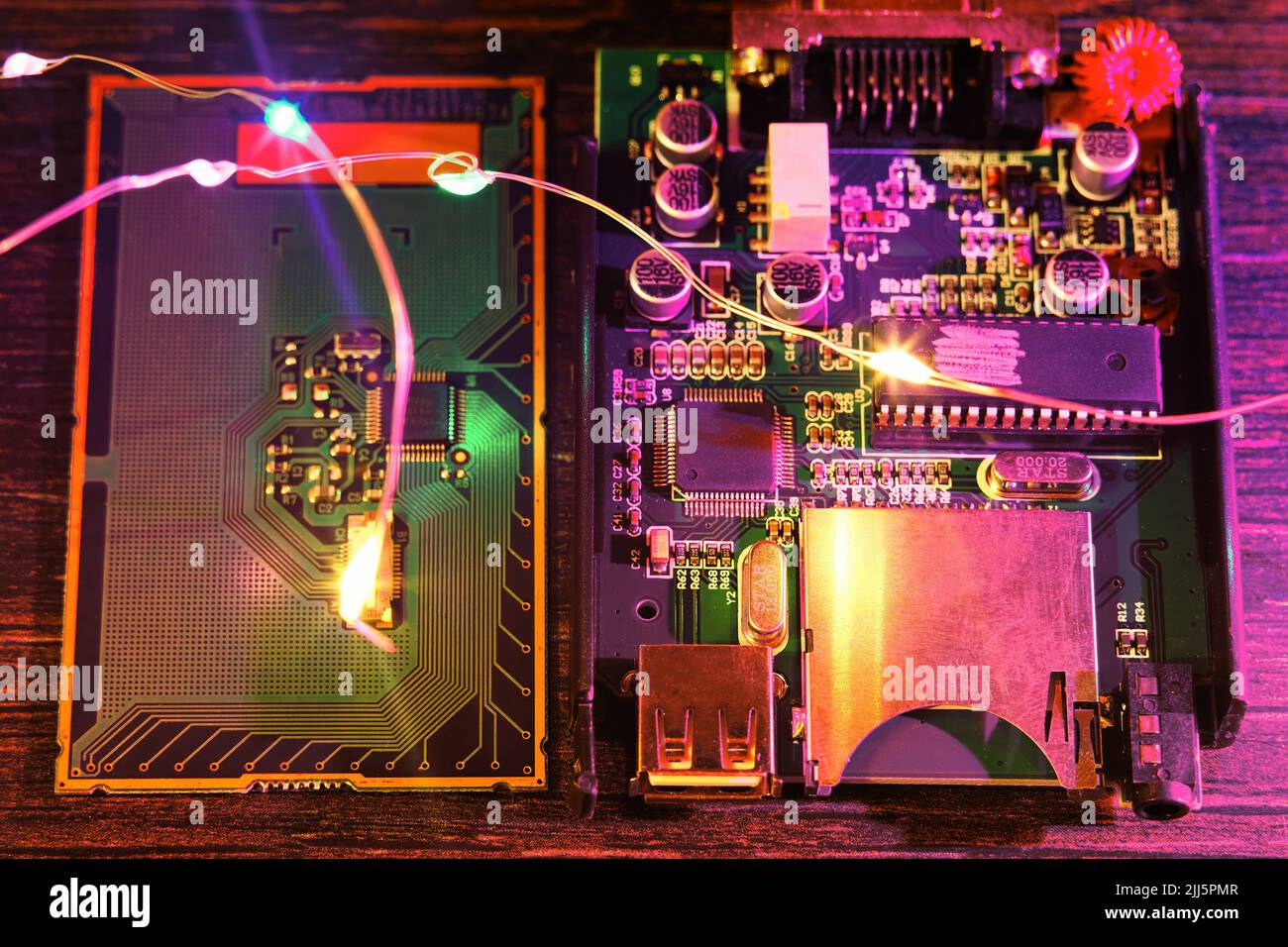 PCB with microchip, microprocessor, wires, neon lights, qubit ...