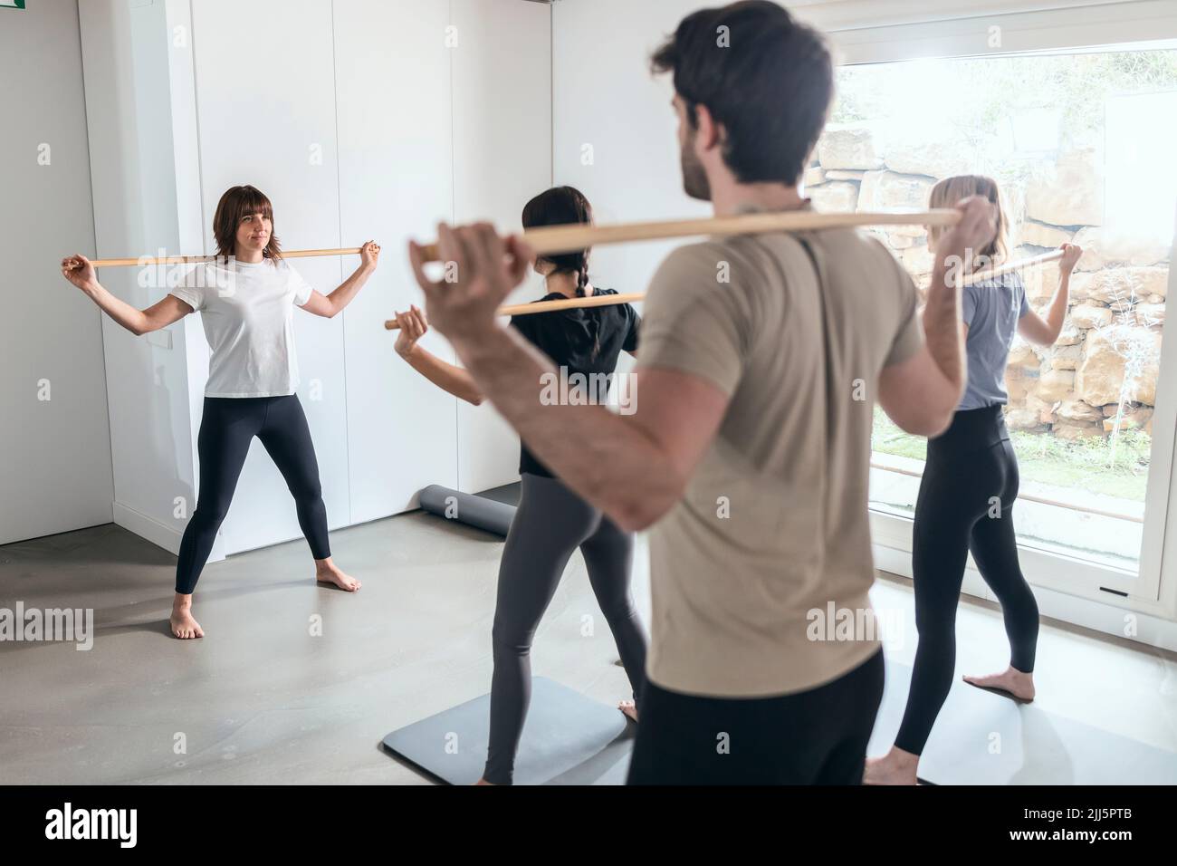 Stick yoga hi-res stock photography and images - Alamy