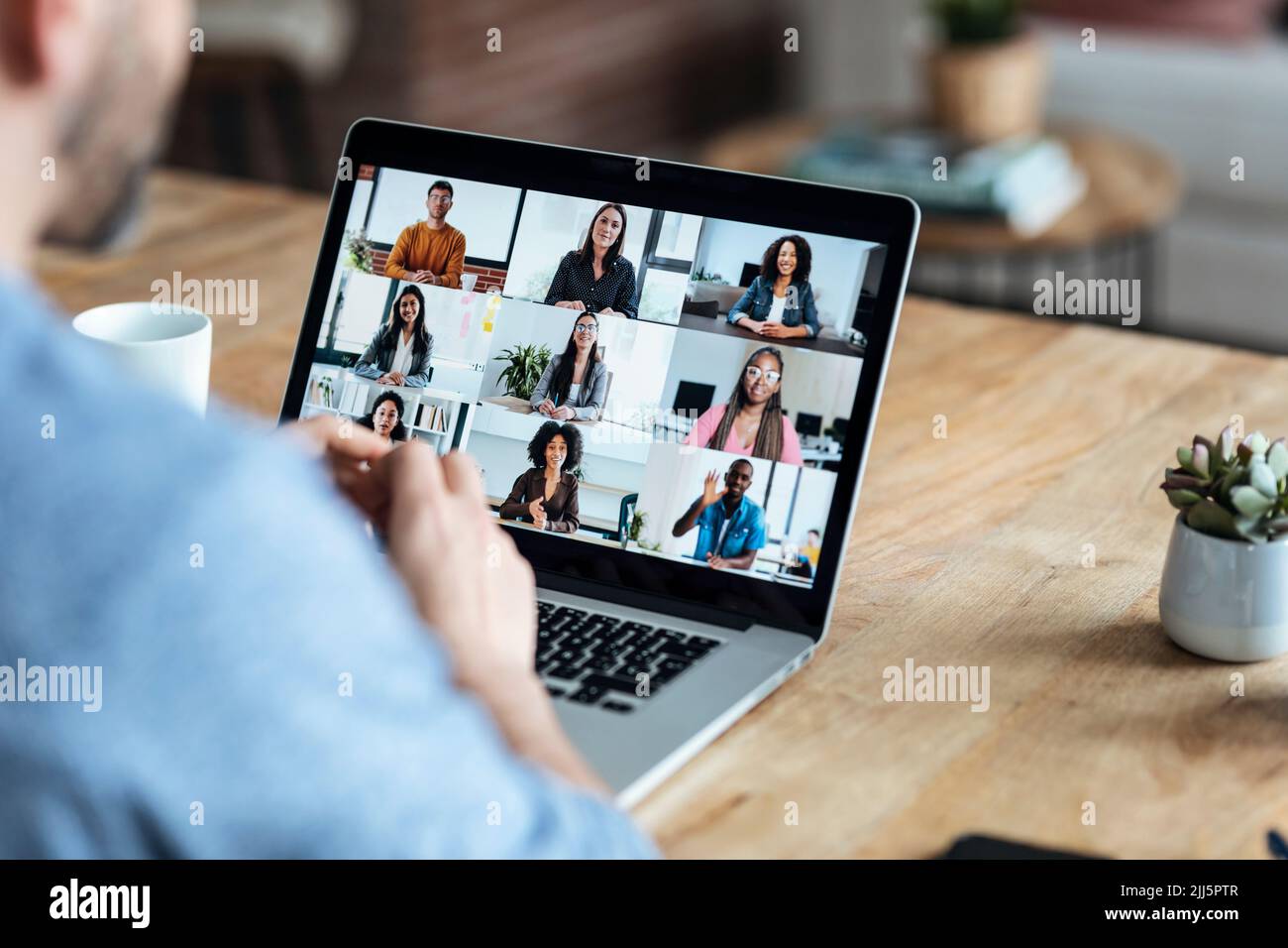 Man video conferencing colleagues hi-res stock photography and images ...