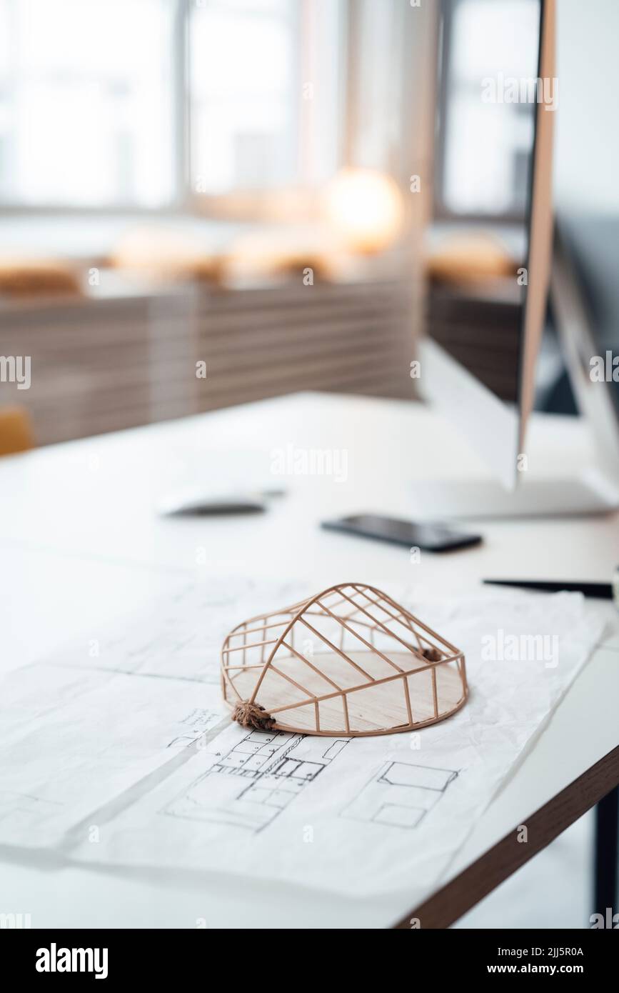 Architectural model with blueprint on desk in office Stock Photo - Alamy