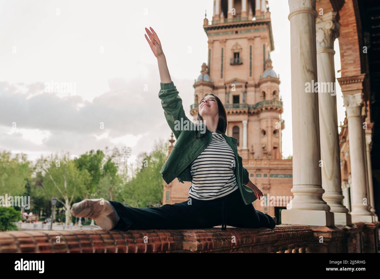 Ballet dancer practicing splits on historic railing Stock Photo - Alamy