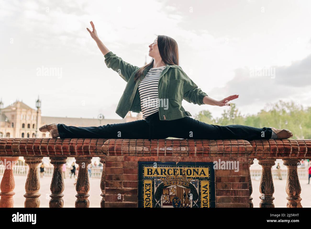 Ballet dancer practicing splits on historic railing Stock Photo - Alamy
