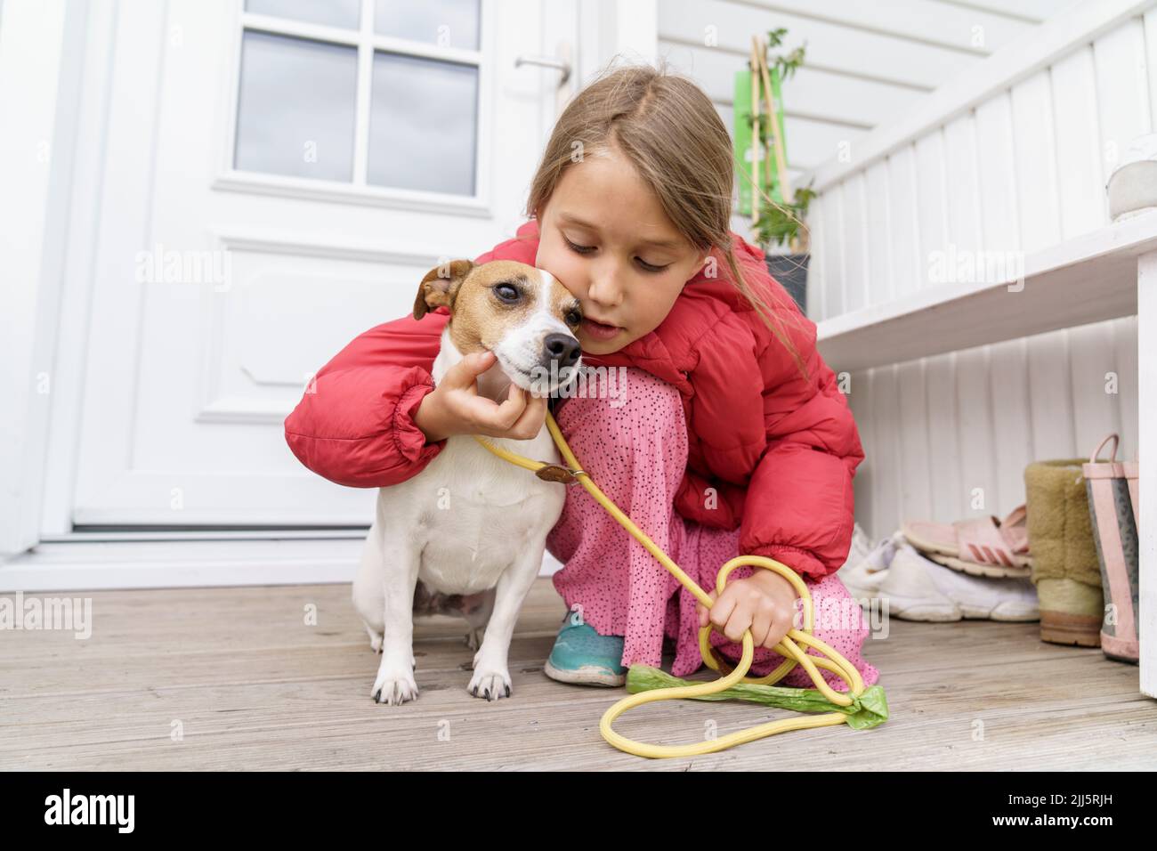 Child petting dog on lead hi-res stock photography and images - Alamy
