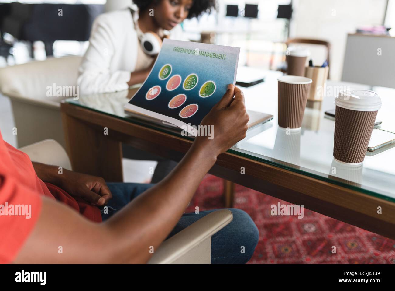 Hand of businessman holding document at office Stock Photo - Alamy