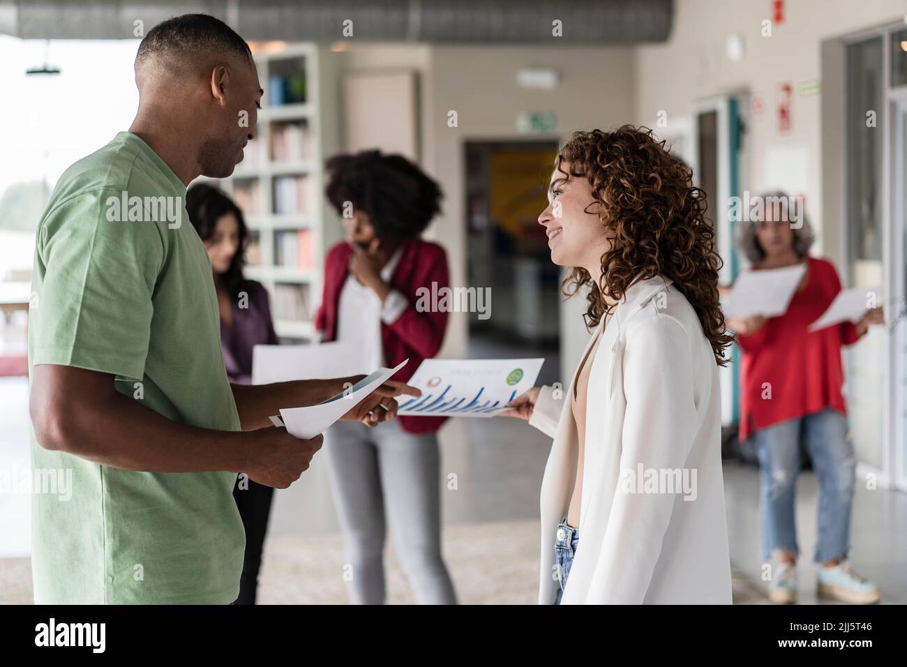 Happy diverse businesswomen discussing work hi-res stock photography ...